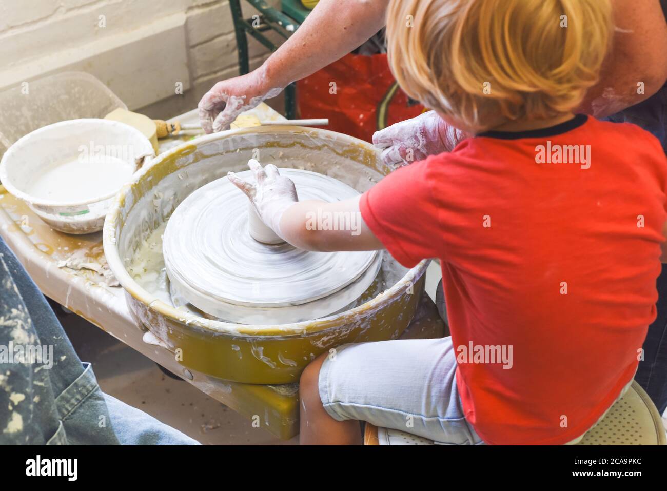 Children making pottery during ceramic lesson with clay Stock Photo - Alamy