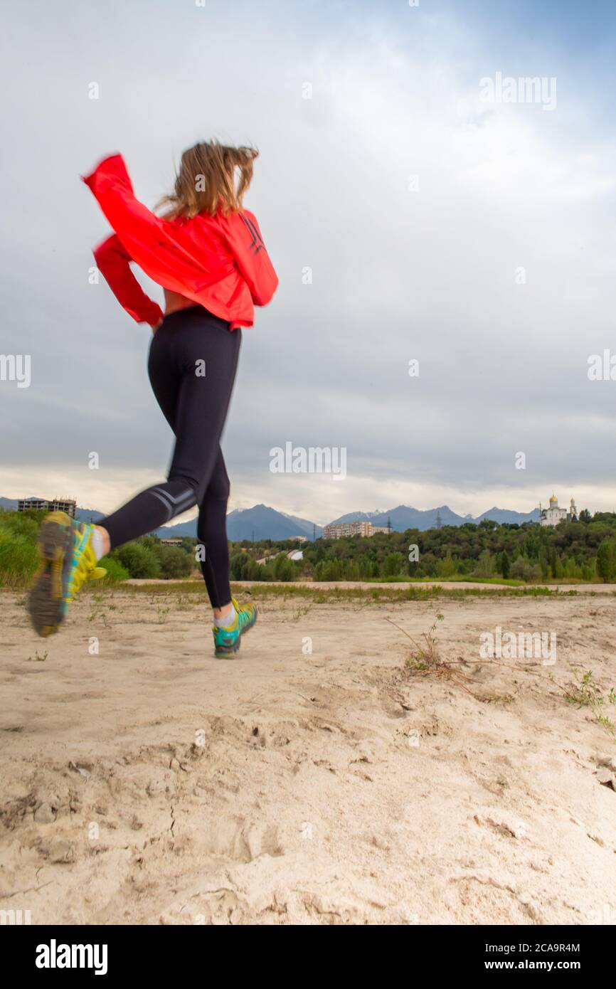 Running in city park. Woman runner outside jogging, mountain view in ...