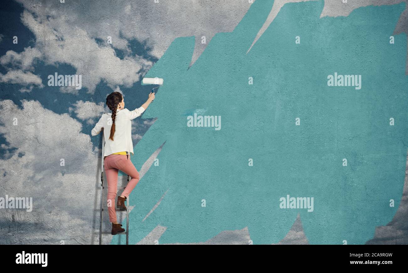 Girl paint wall in colors Stock Photo - Alamy