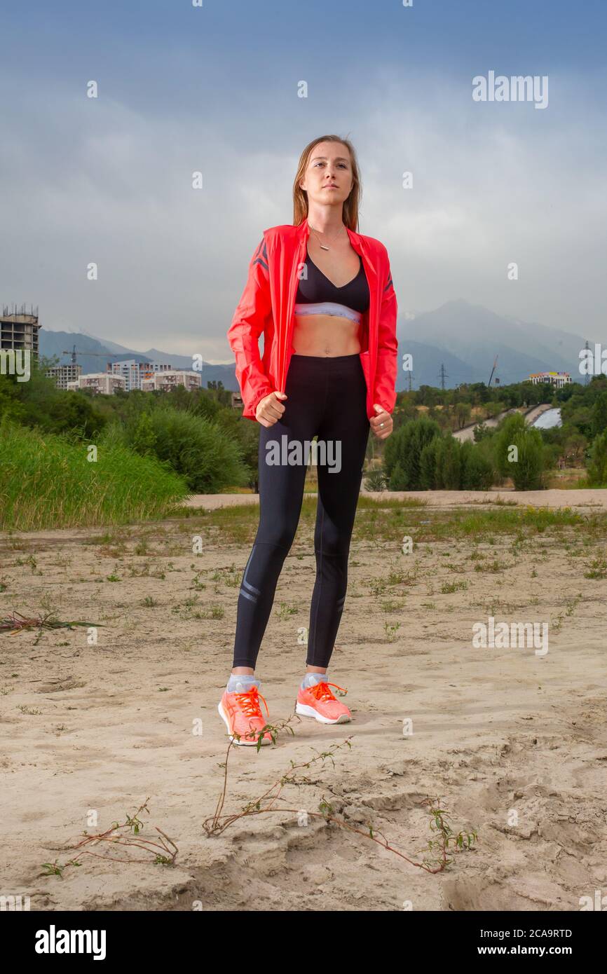 Fitness woman runner relaxing after city running, Girl looking and ...