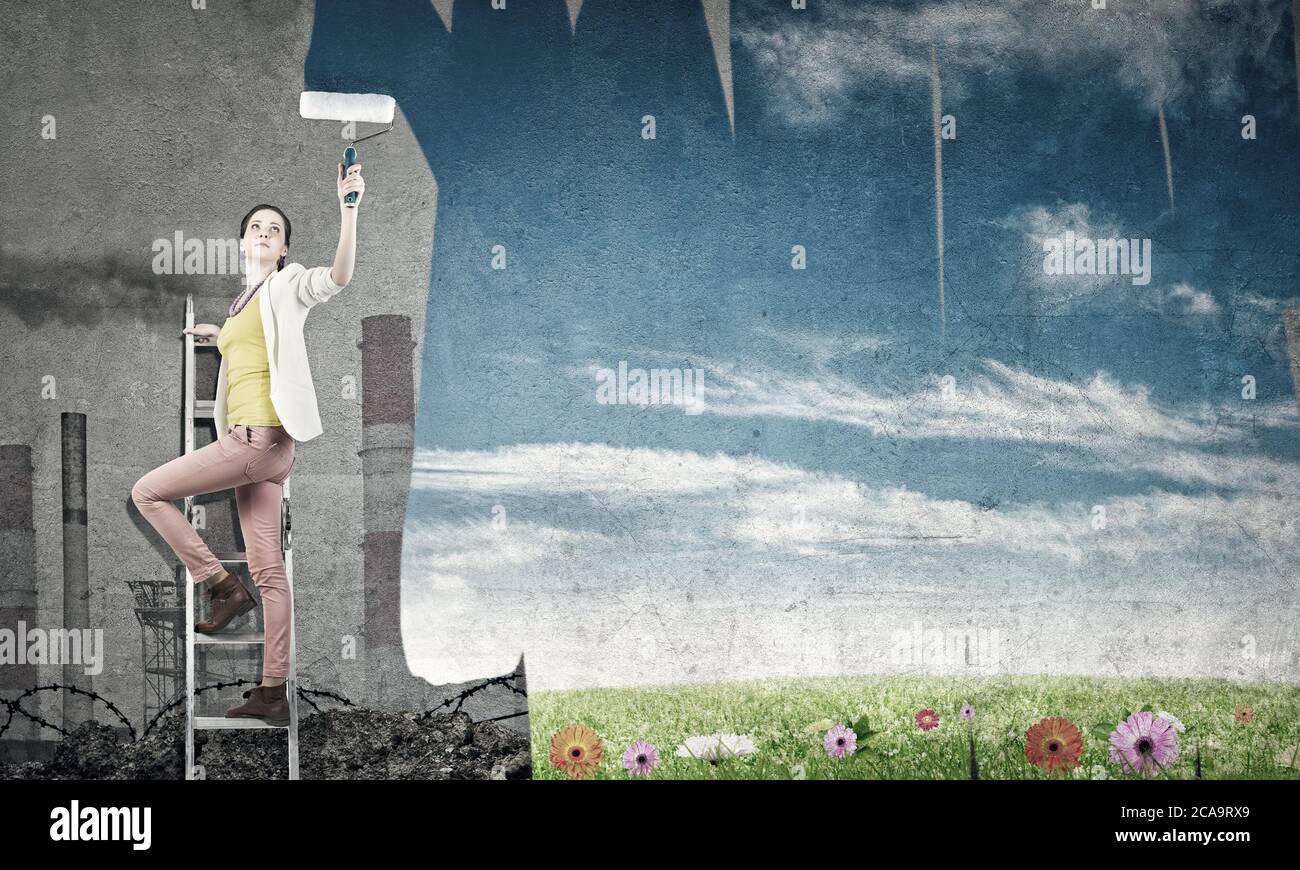 Girl paint wall in colors Stock Photo - Alamy