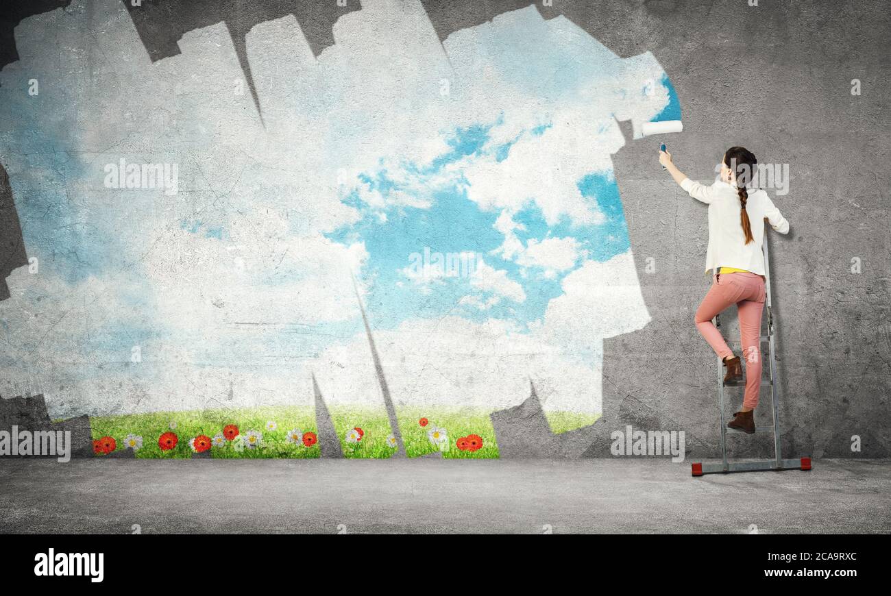Girl paint wall in colors Stock Photo - Alamy