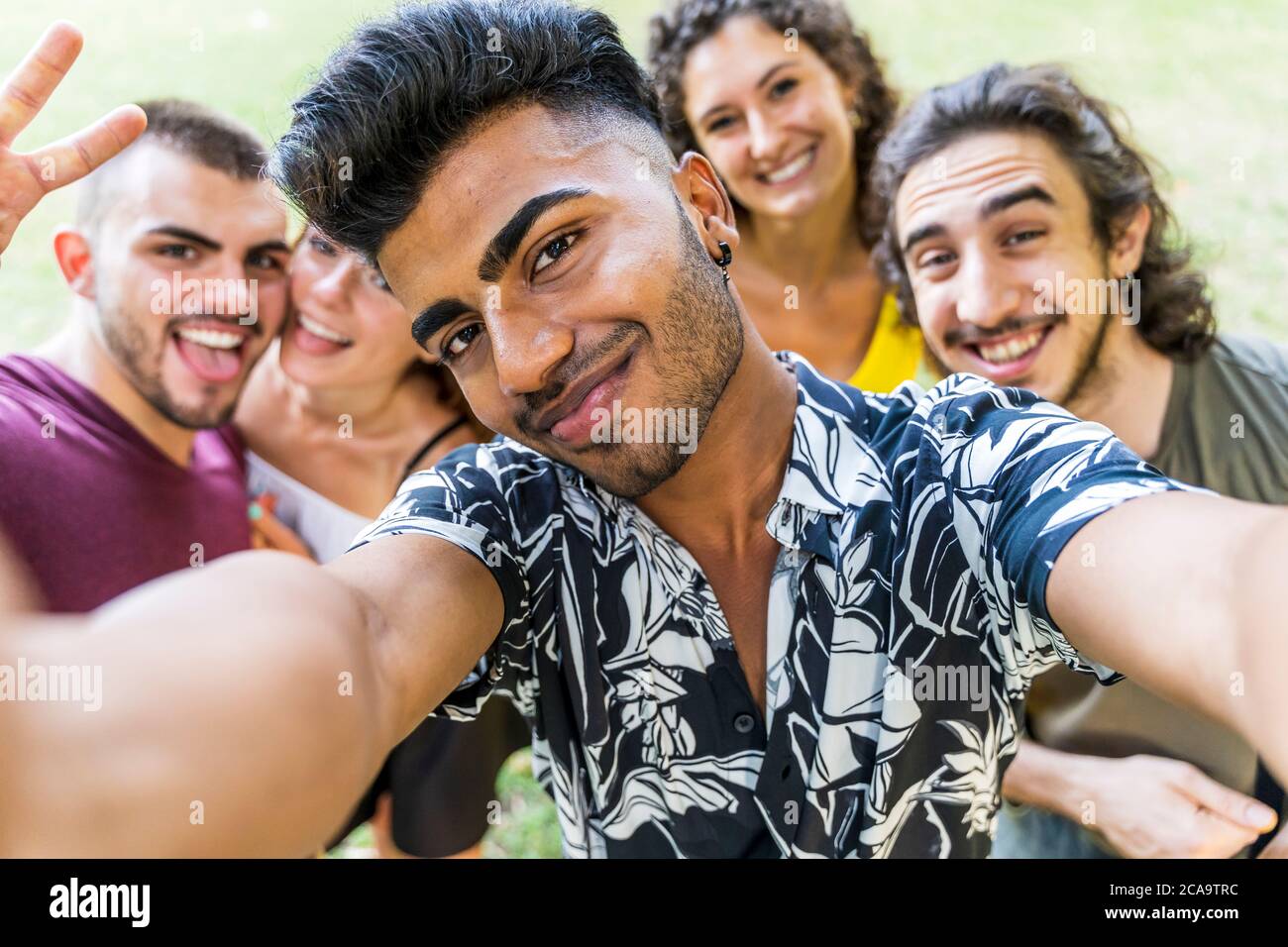 multiethnic group of millennial friends take a selfie outdoors Stock ...