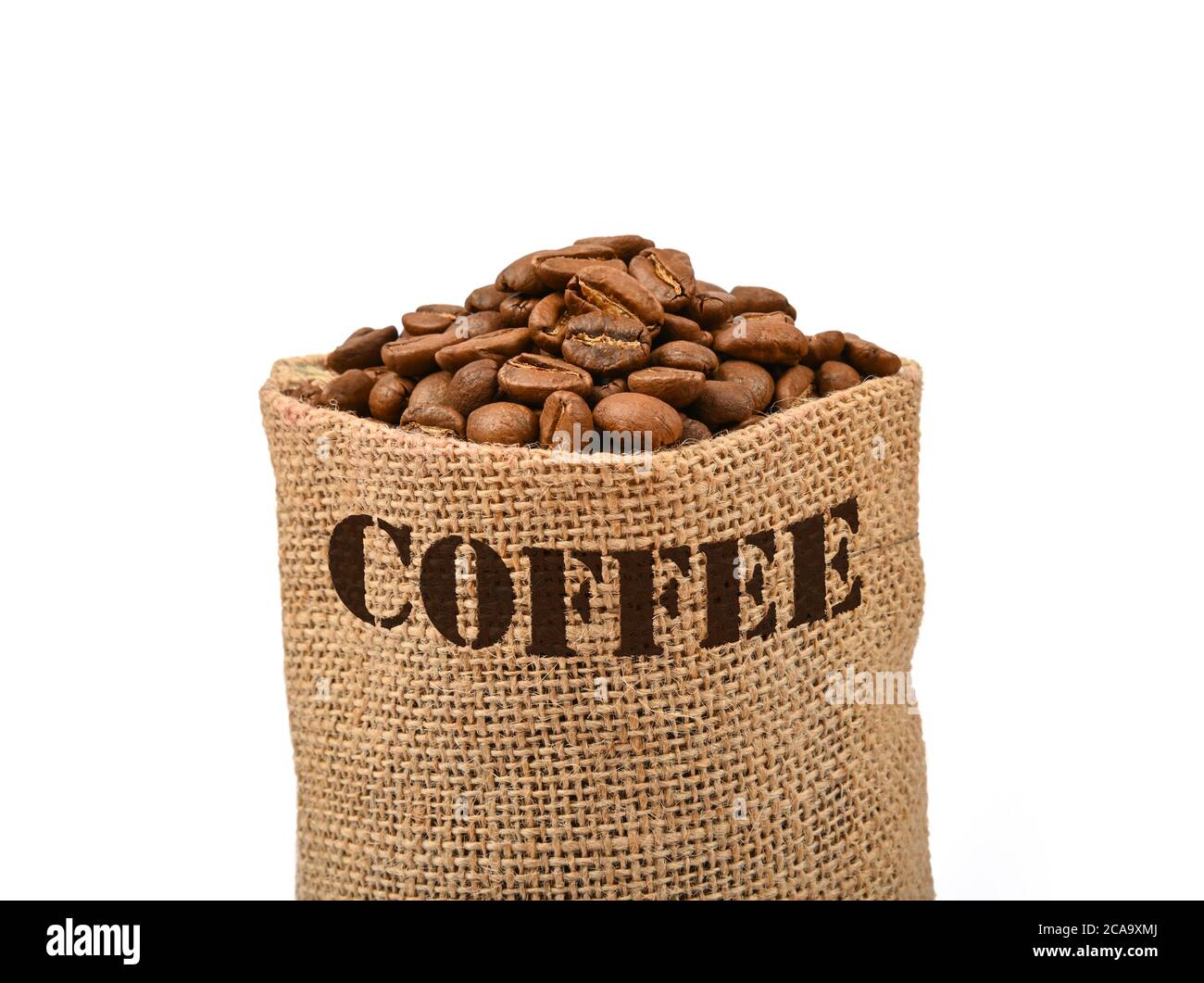 Close up one jute canvas bag of roasted Arabica coffee beans isolated ...