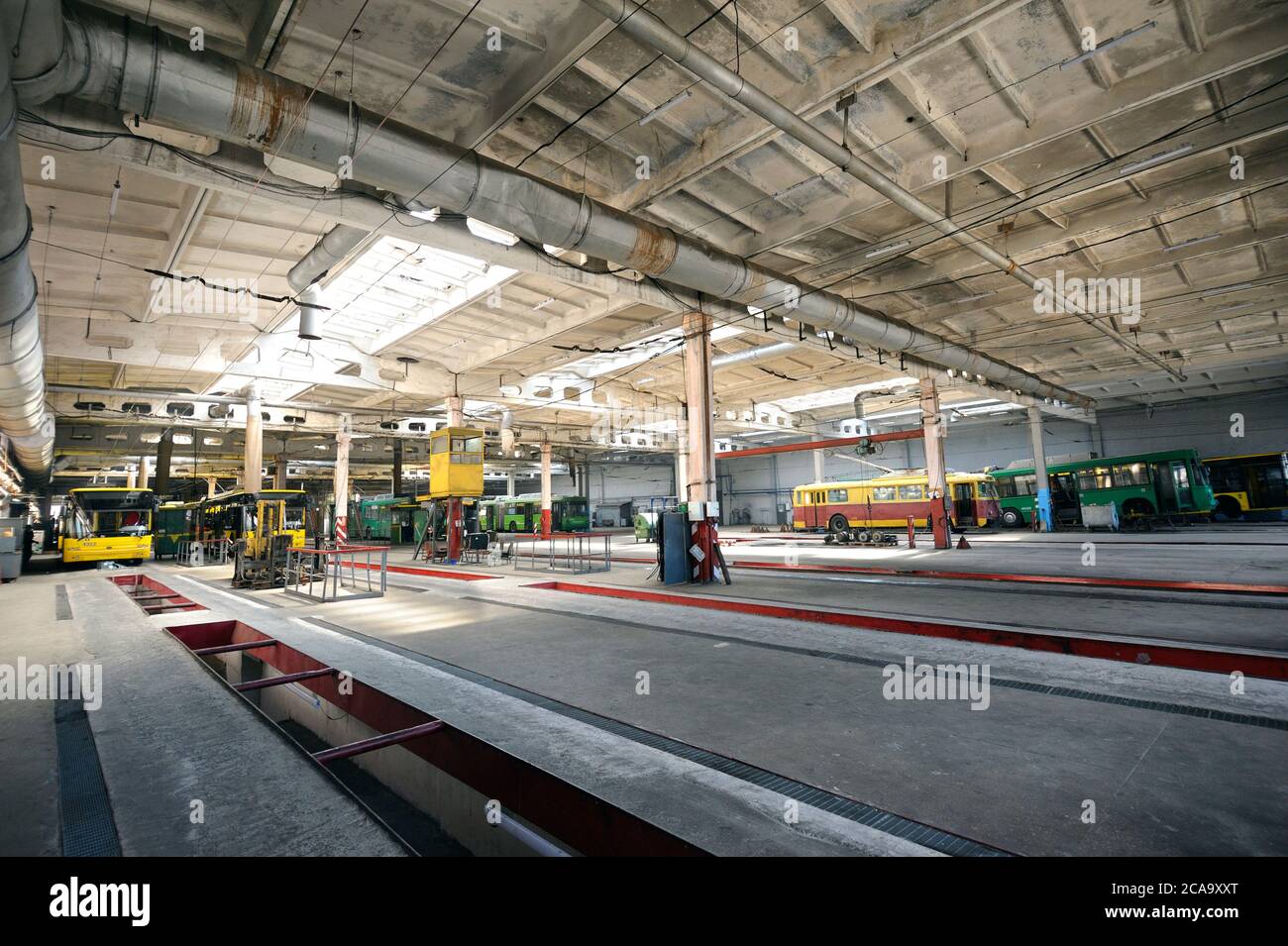 Trolleybuses parked at the trolley depot hangar for technical ...