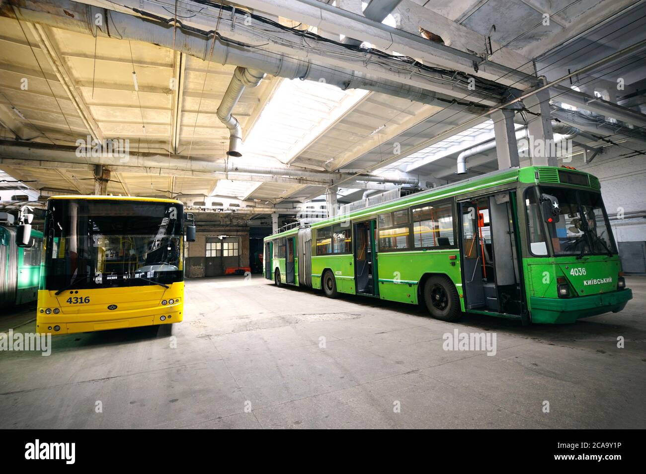 Trolleybuses parked at the trolley depot hangar for technical ...