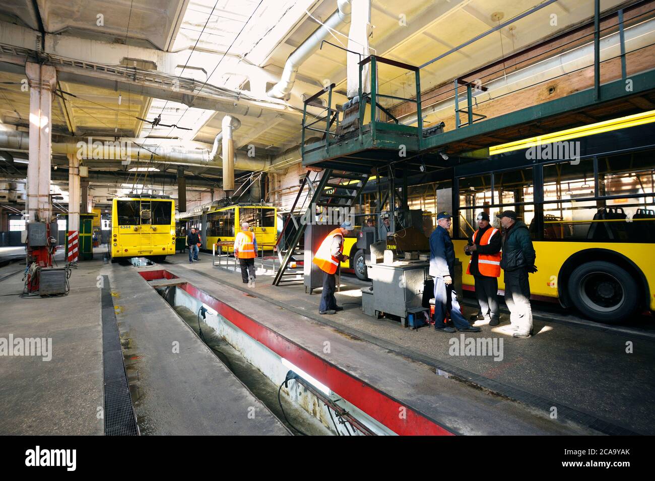 Trolleybuses parked at the trolley depot hangar for technical ...
