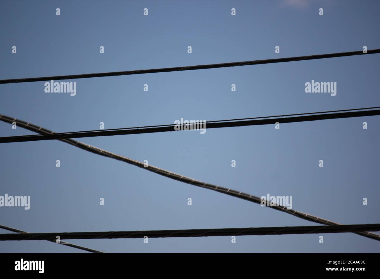Bunch of electrical and power utility wires hanging in the backyard ...