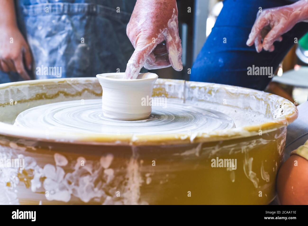 Children making pottery during ceramic lesson with clay Stock Photo - Alamy