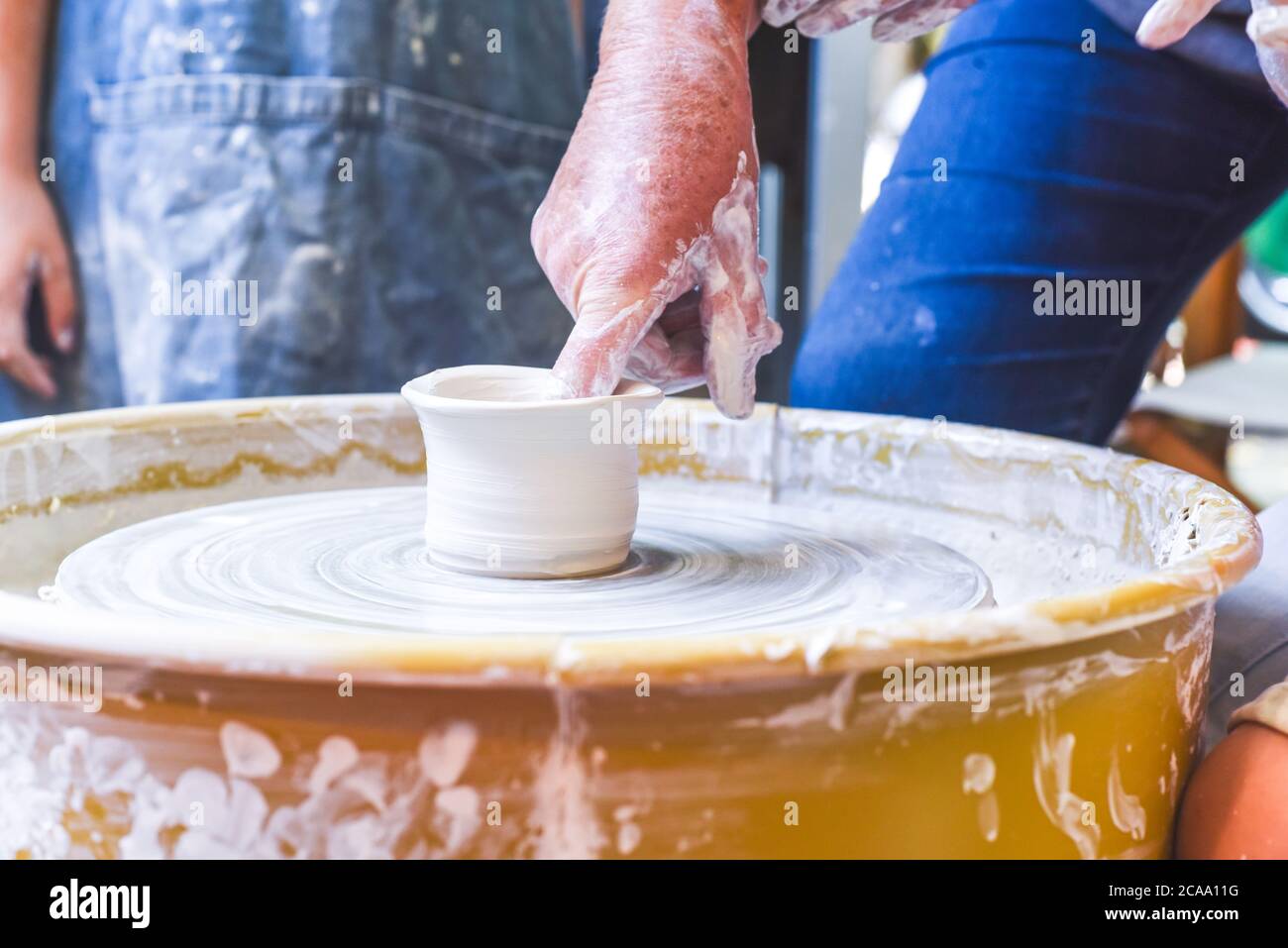 Children making pottery during ceramic lesson with clay Stock Photo - Alamy