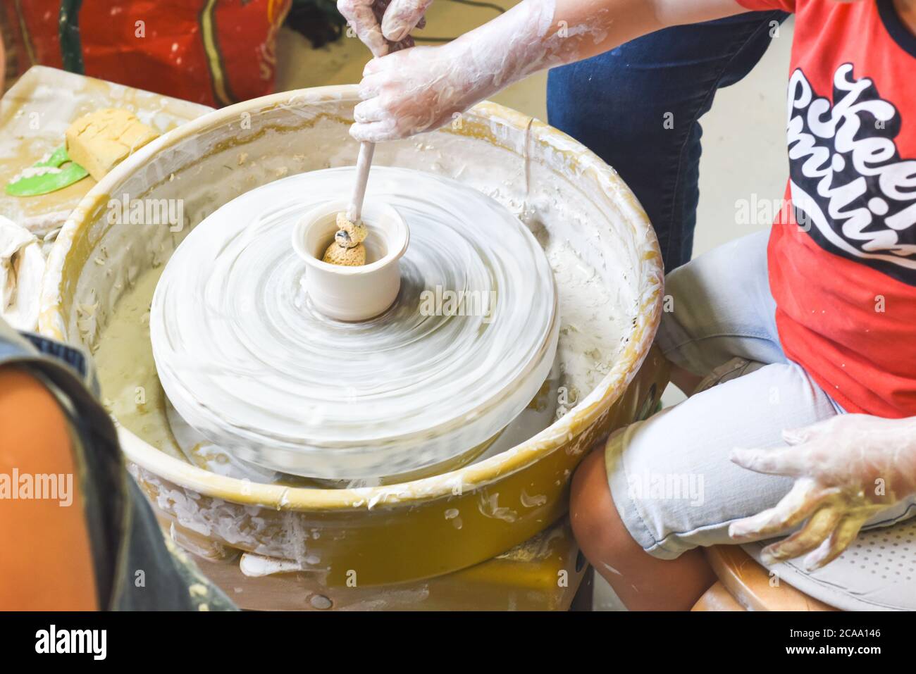 Children making pottery during ceramic lesson with clay Stock Photo - Alamy