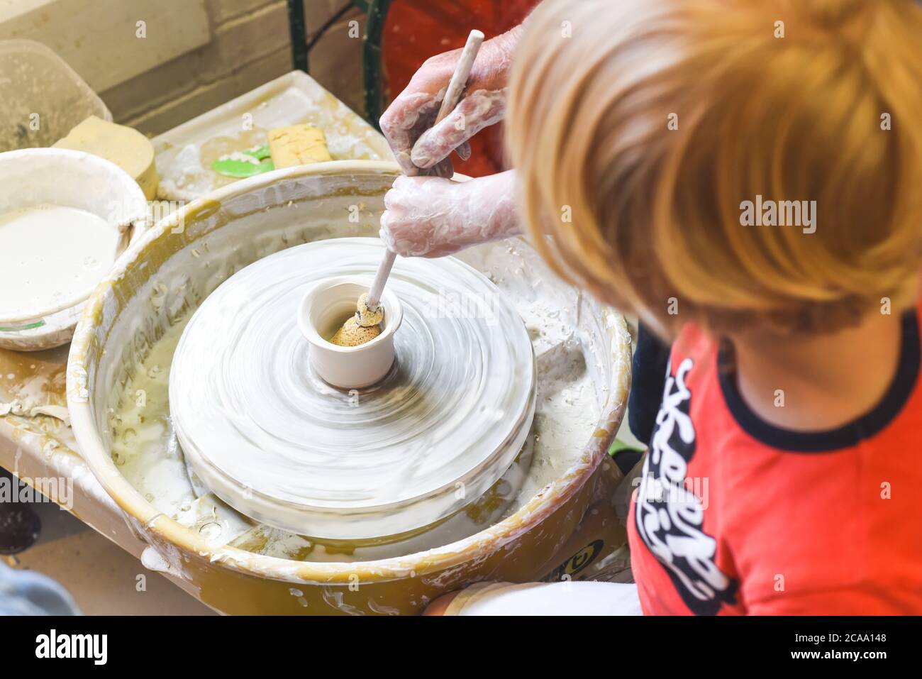 Children making pottery during ceramic lesson with clay Stock Photo - Alamy