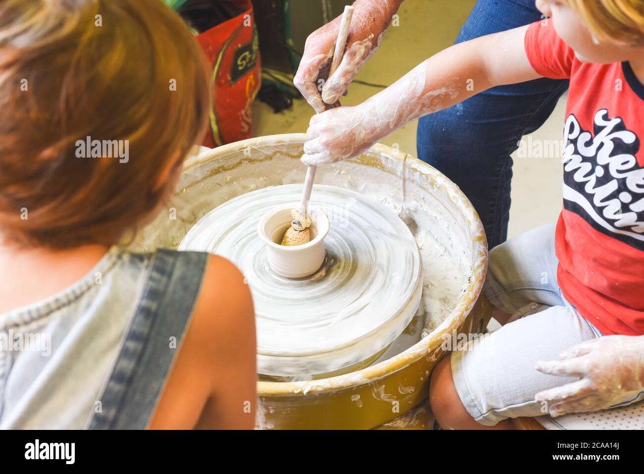 Children making pottery during ceramic lesson with clay Stock Photo - Alamy