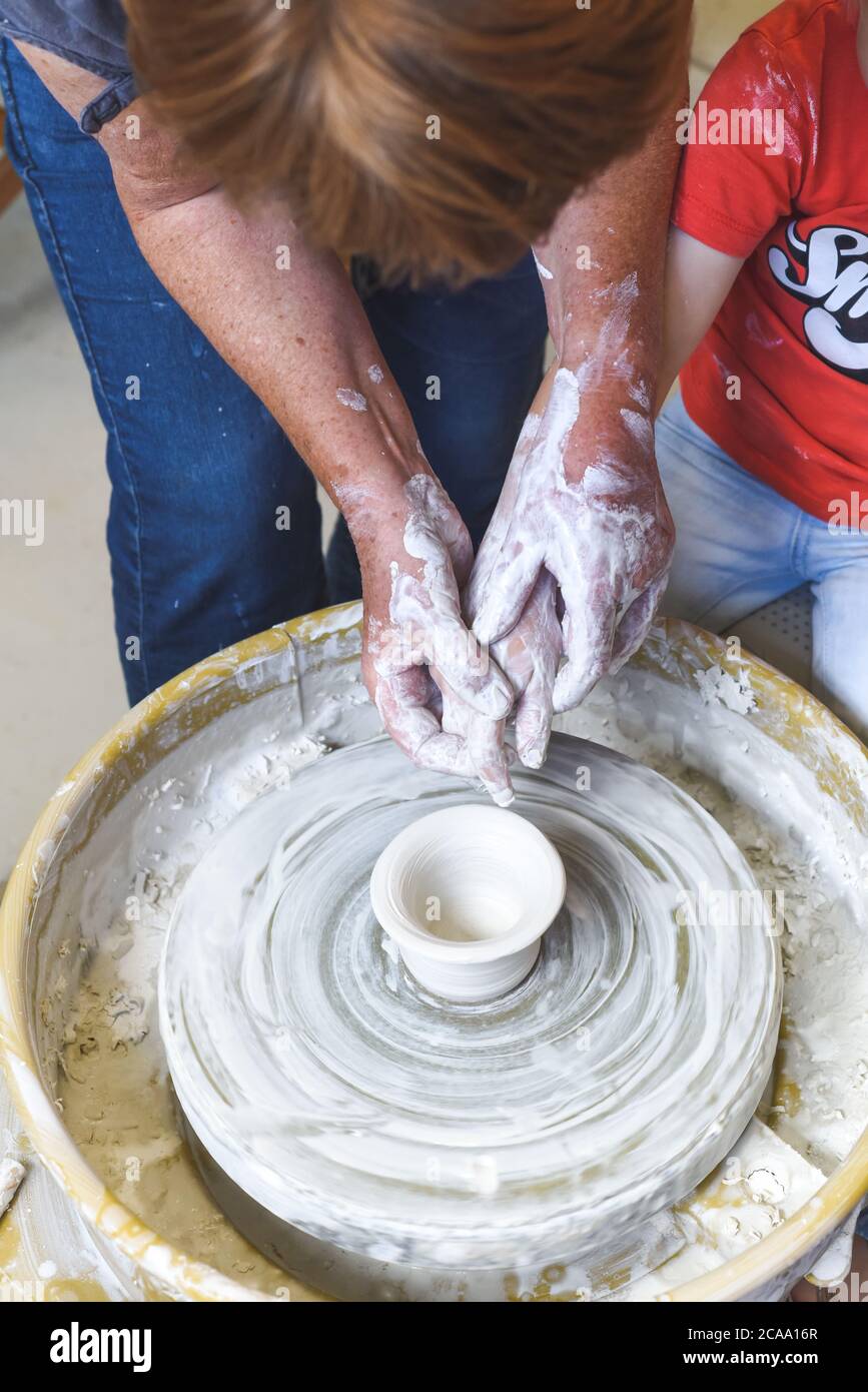 Children making pottery during ceramic lesson with clay Stock Photo - Alamy