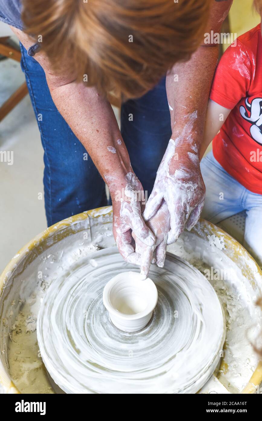 Children making pottery during ceramic lesson with clay Stock Photo - Alamy