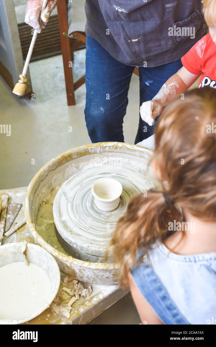 Children making pottery during ceramic lesson with clay Stock Photo - Alamy