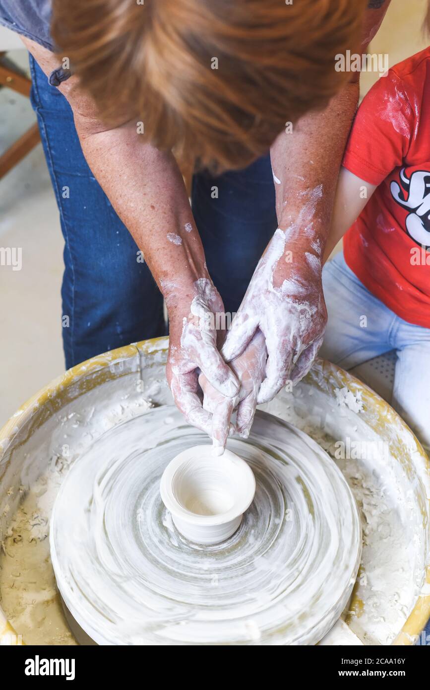Children making pottery during ceramic lesson with clay Stock Photo - Alamy