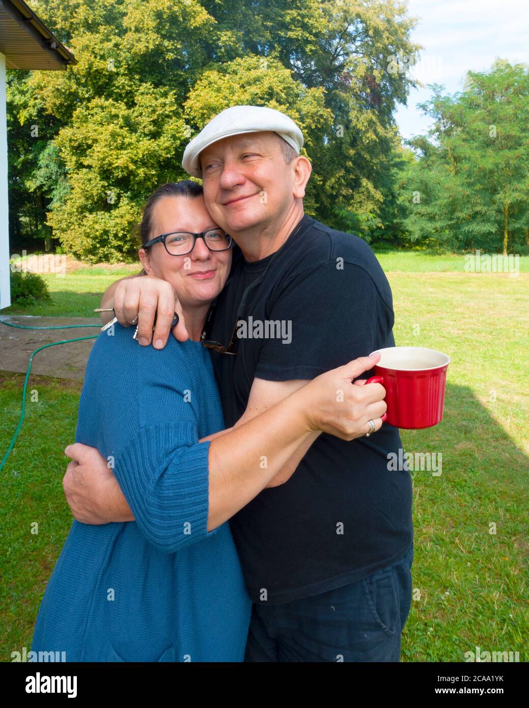 Polish father and daughter hugging each other while still holding her ...