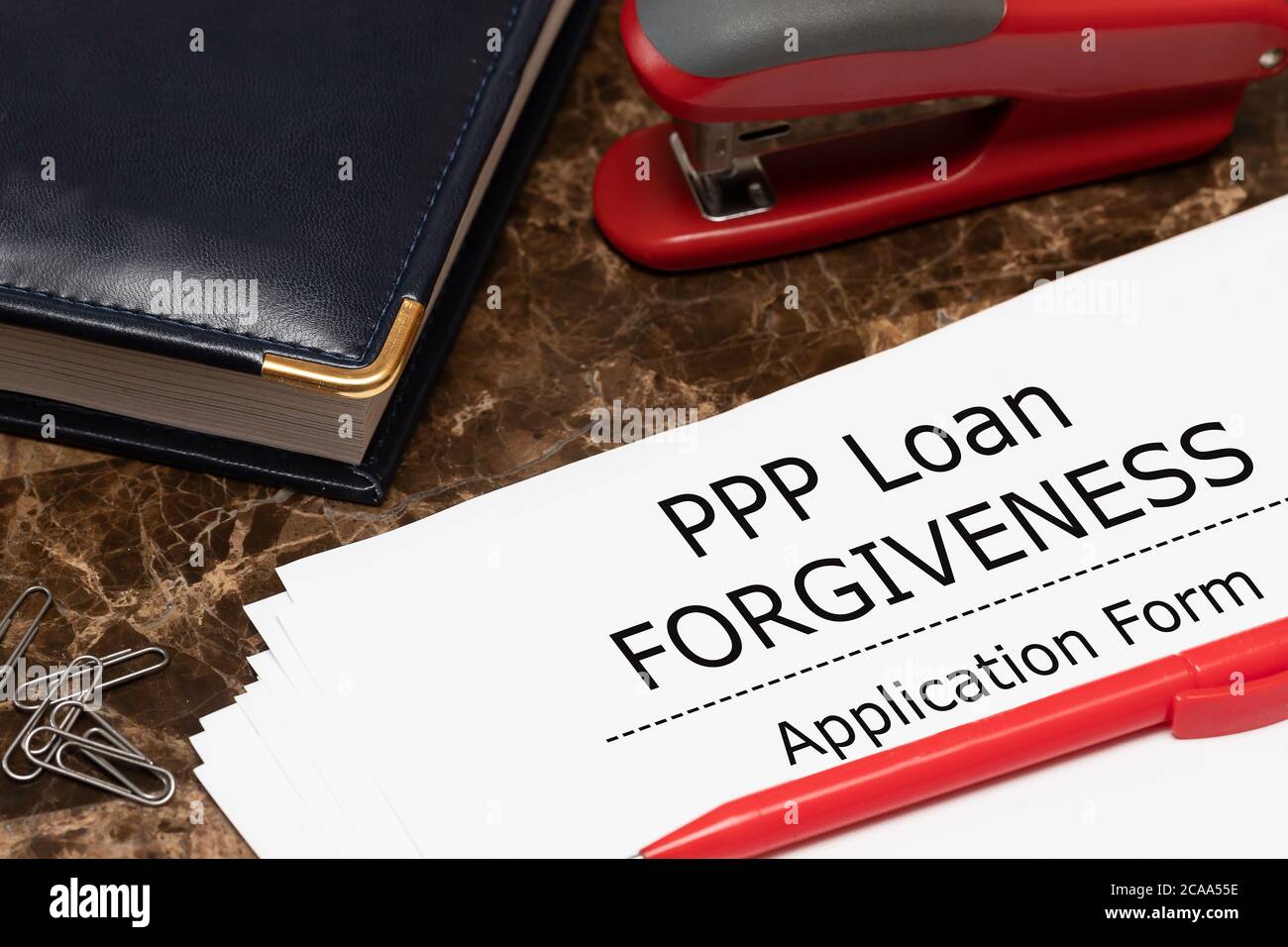 PPP loan forgiveness text on application form paper. Small Business ...