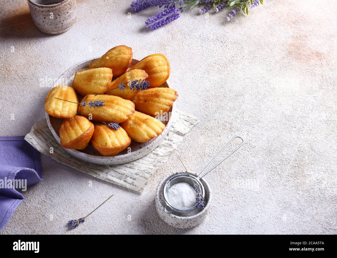 french traditional madeleine biscuits with lavender Stock Photo - Alamy