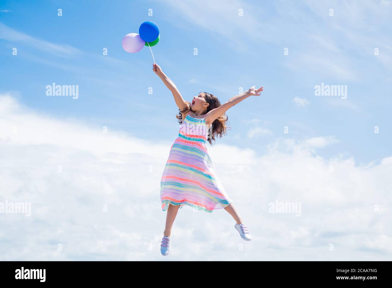 fly away. happy childhood. little child with balloons. Entertainment ...