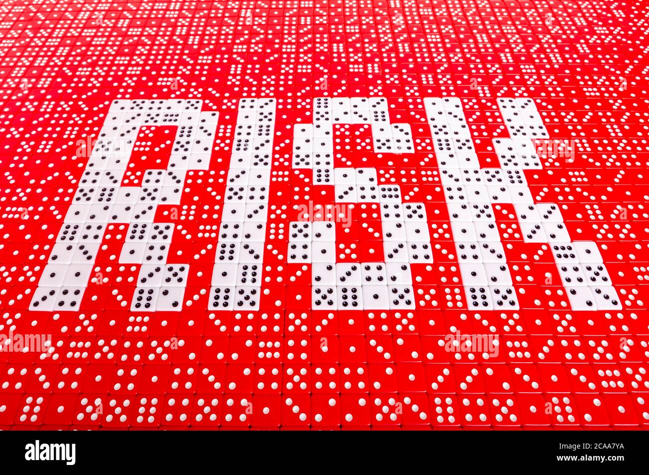 The word RISK spelled in a field of dice Stock Photo - Alamy