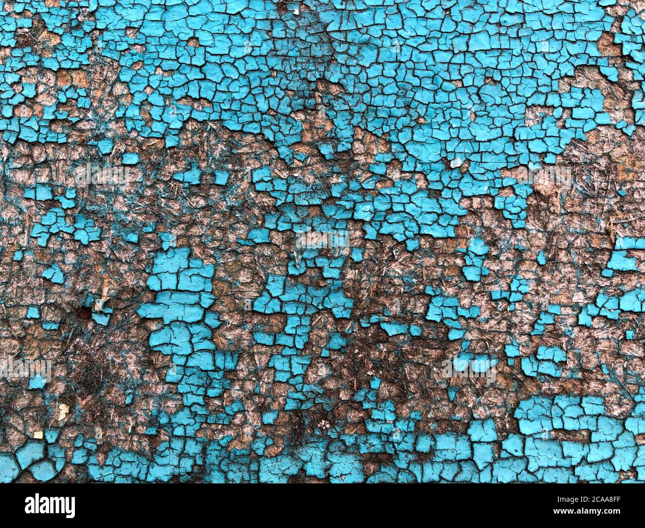 The old blue wooden creaked fence Stock Photo - Alamy