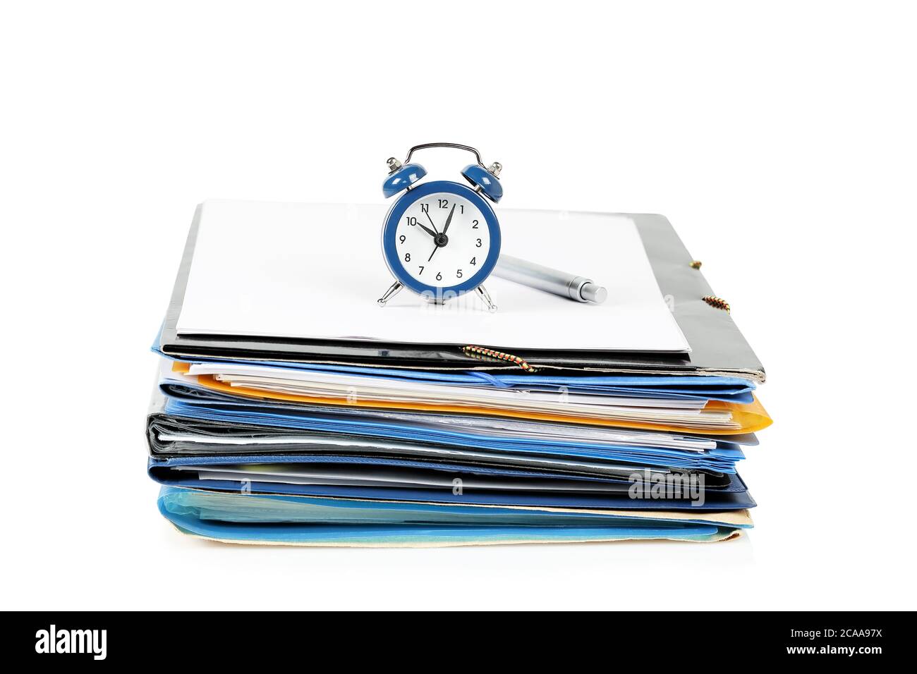 alarm clock on stack of paper and folders, concept for paperwork Stock ...