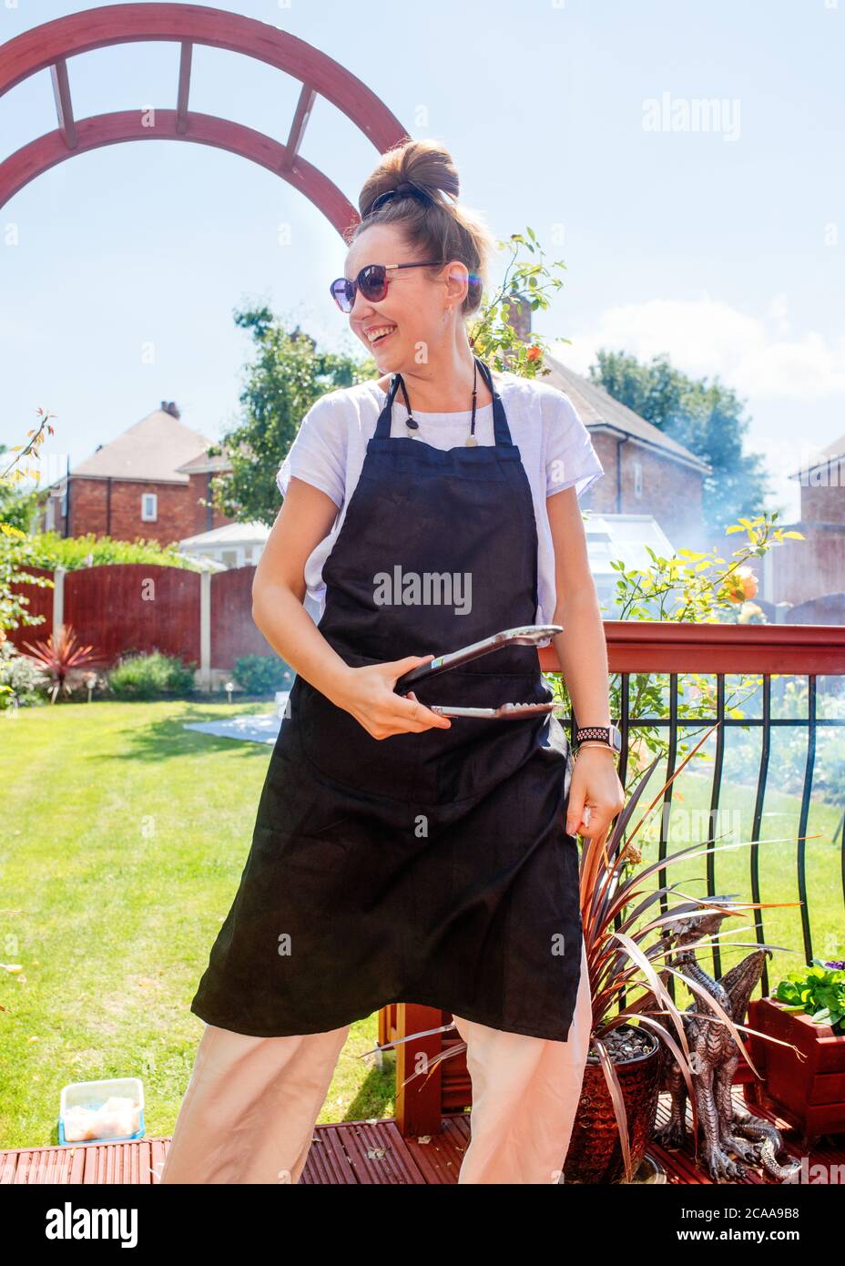 Young woman dancing barbecue hi-res stock photography and images - Alamy