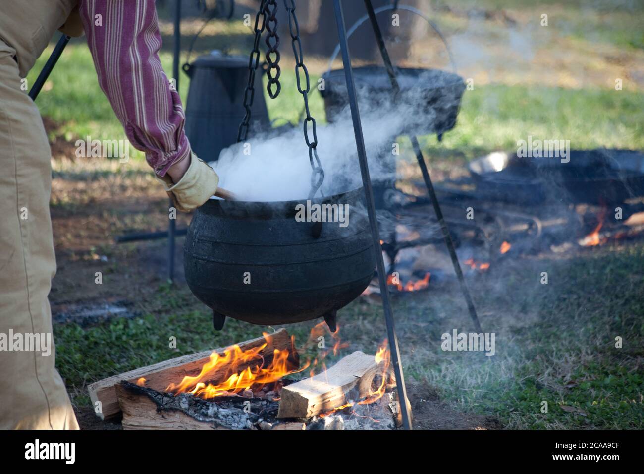 Cast Iron Cooking outdoors Stock Photo - Alamy