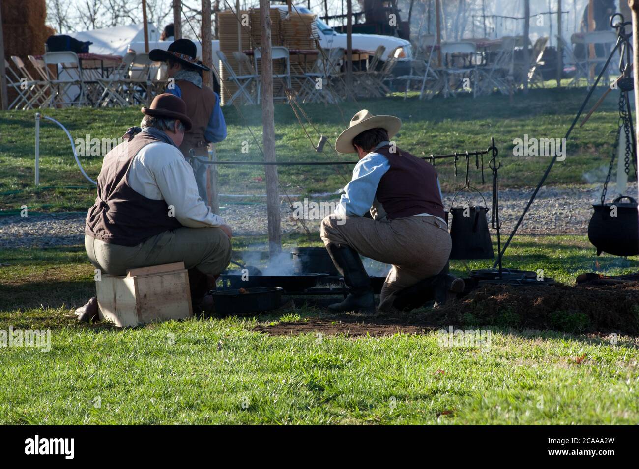 Cowboy cooking over an open fire Stock Photo - Alamy