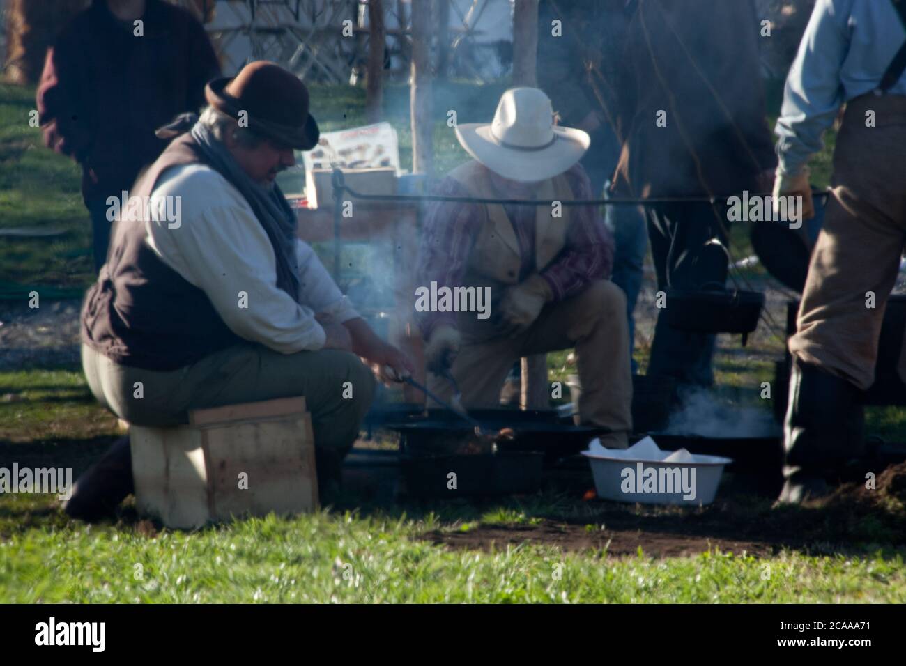 Cowboy cooking over an open fire Stock Photo - Alamy