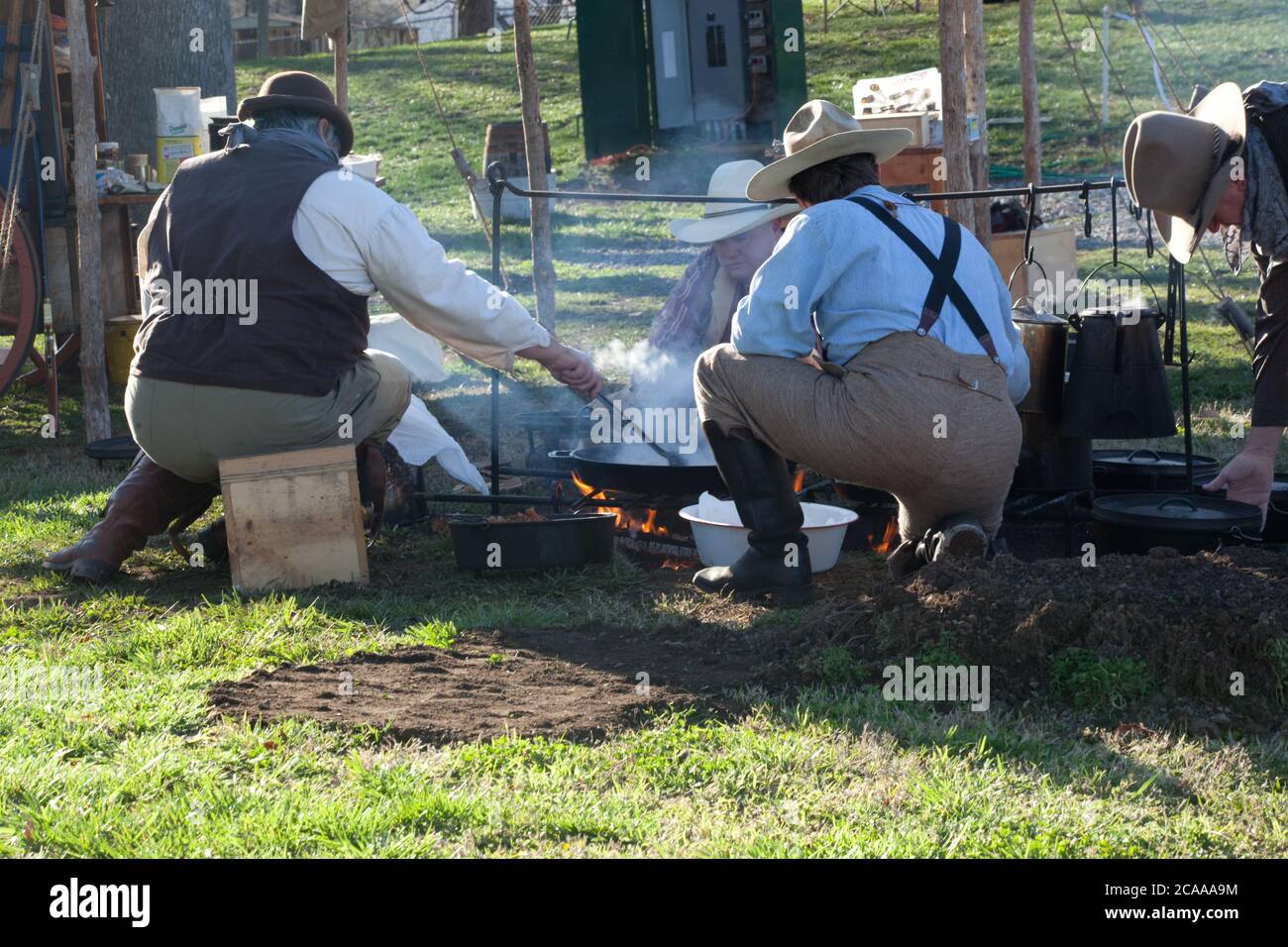 Cowboy cooking over an open fire Stock Photo - Alamy