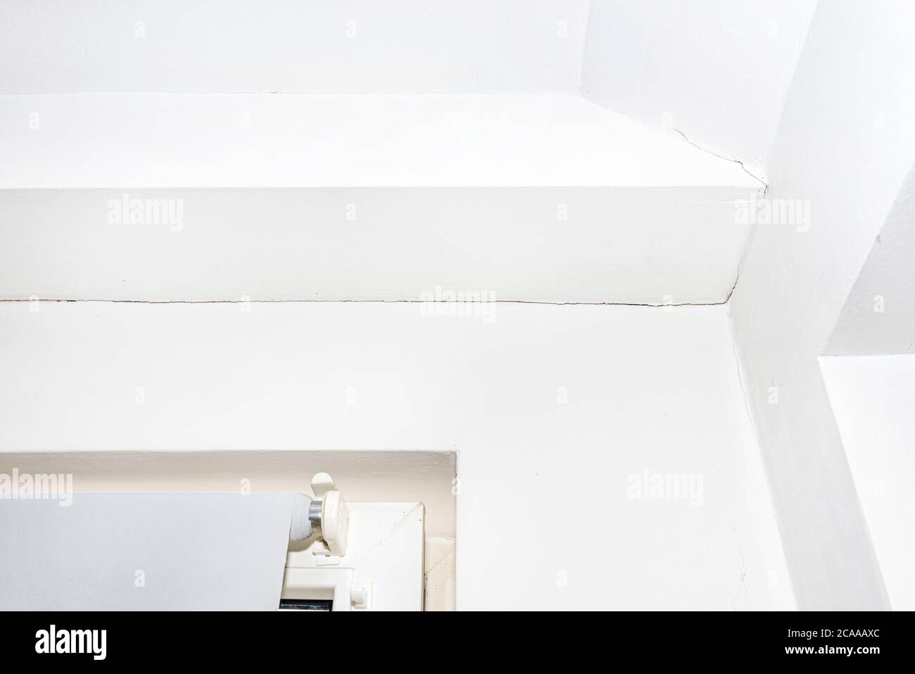 Longitudinal crack in the lintel wall above the window inside the ...