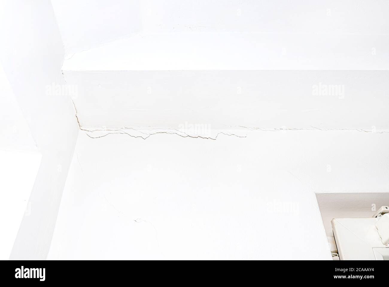 Longitudinal crack in the lintel wall above the window inside the ...