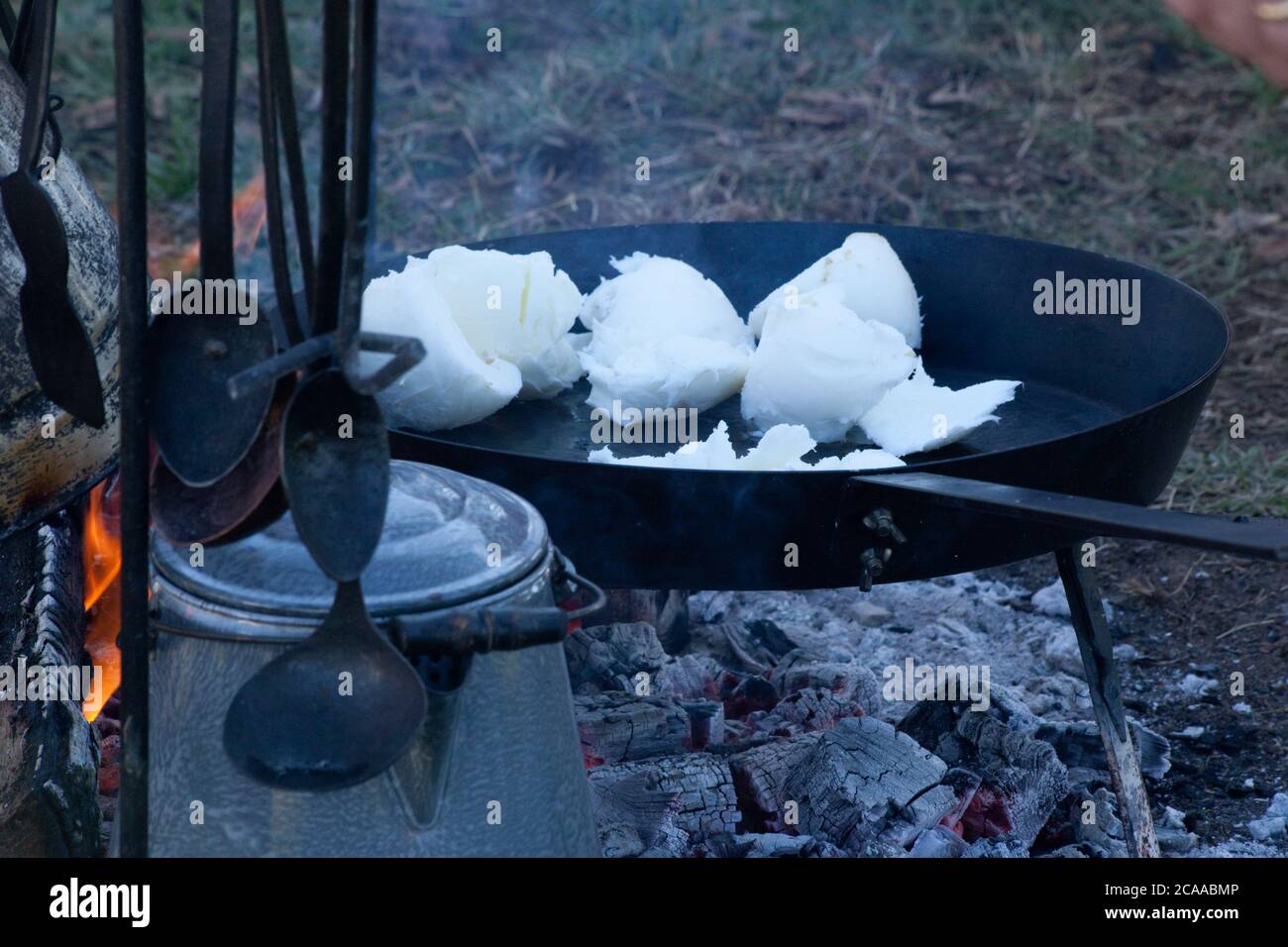 Cast Iron Skillet over a fire outdoors Stock Photo - Alamy