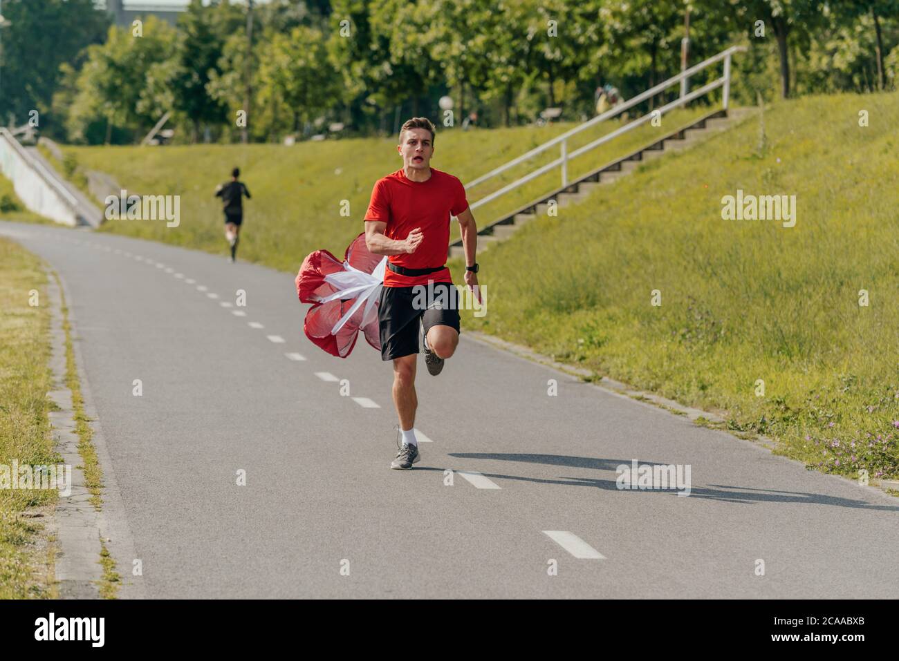 Athlete man running with parachute hi-res stock photography and images ...