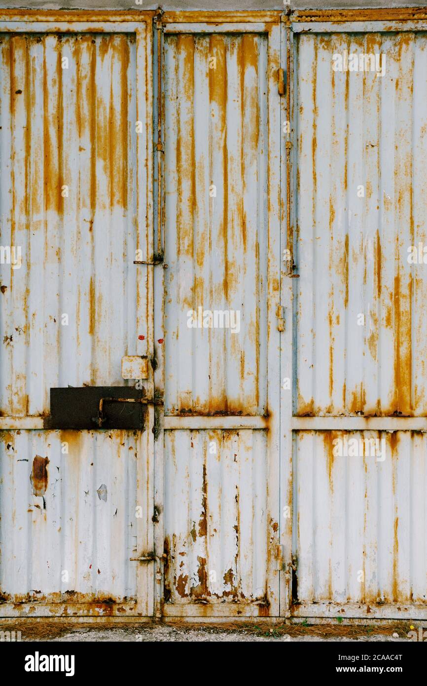 Old metal gate with peeling paint and rust and an iron bolt Stock Photo ...