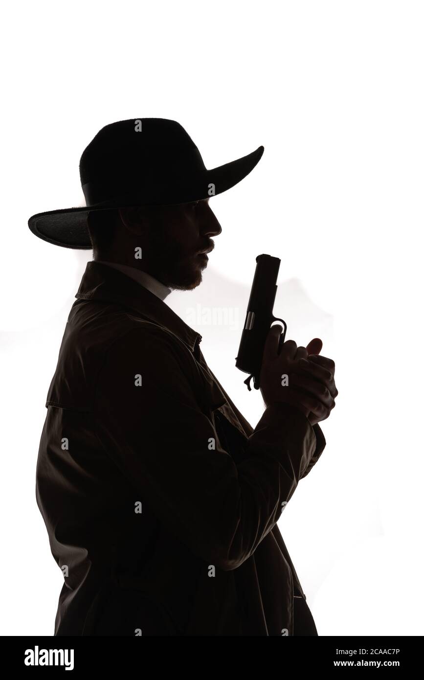 Profile shot of an attractive young guy posing in modern style cowboy ...