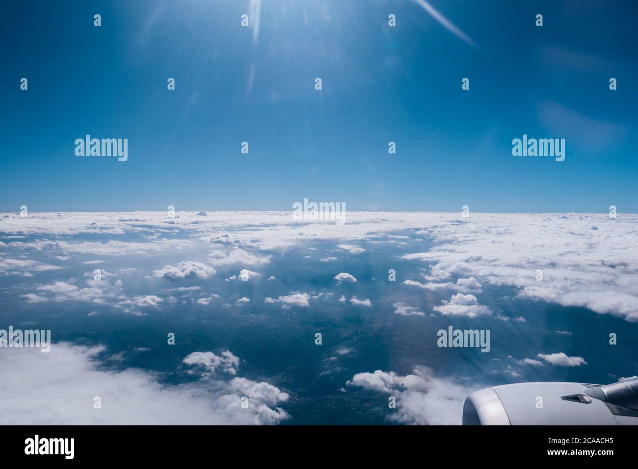 Magnificent view from above the clouds through an airplane window Stock ...