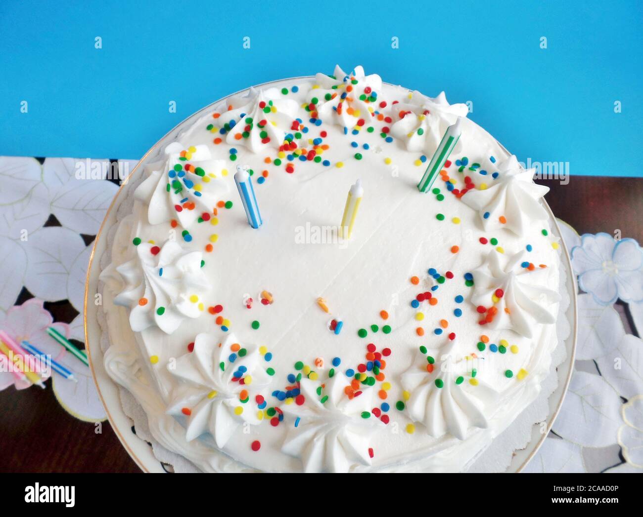 Birthday cake with white icing Stock Photo - Alamy