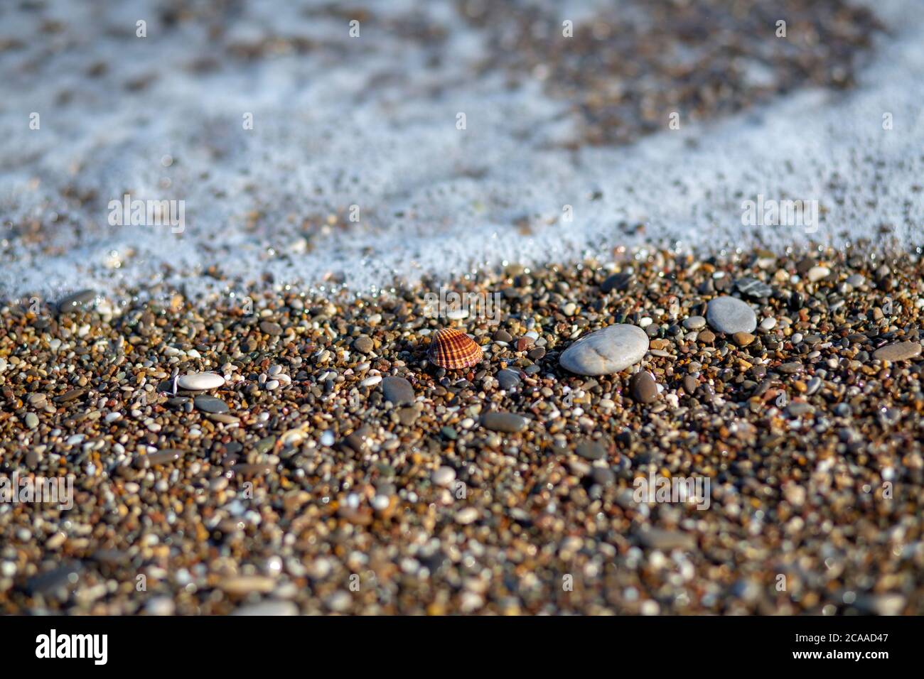 Small waves and sand particles by the sea in Antalya Stock Photo - Alamy