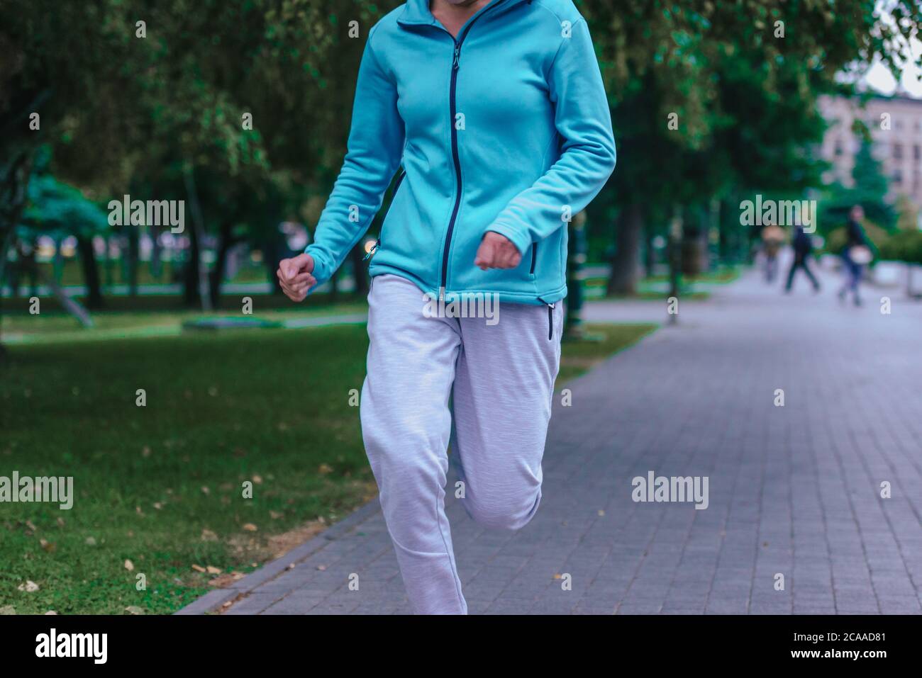 Healthy lifestyle athlete dressed in training clothes exercising Stock ...