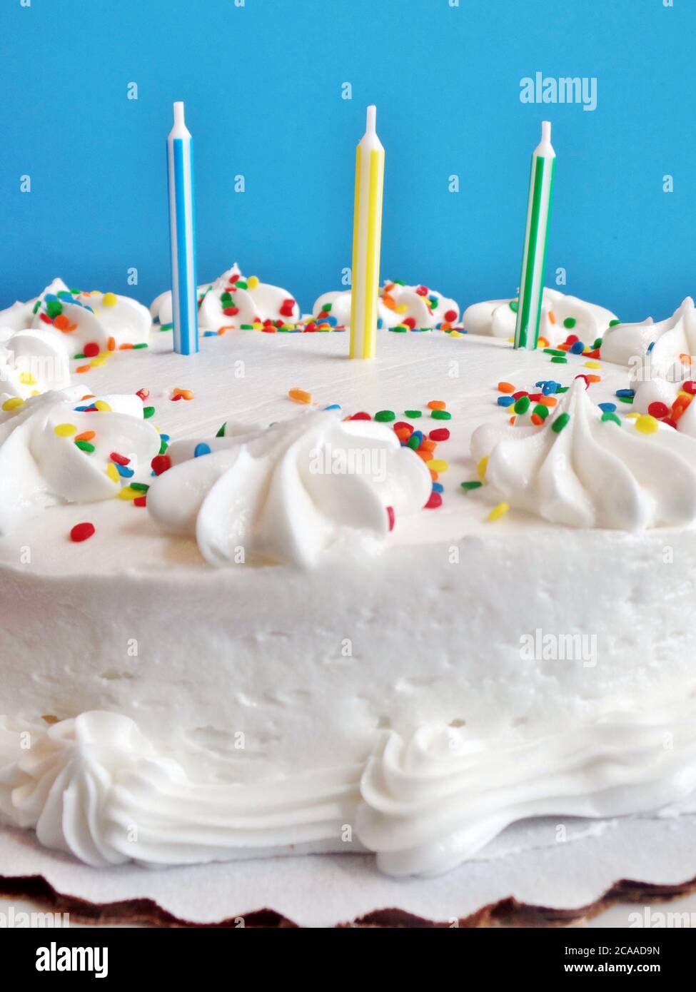 Birthday cake with white icing Stock Photo - Alamy