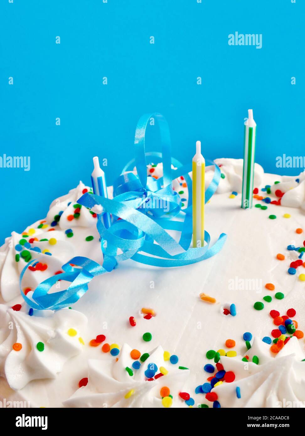 Birthday cake with white icing Stock Photo - Alamy