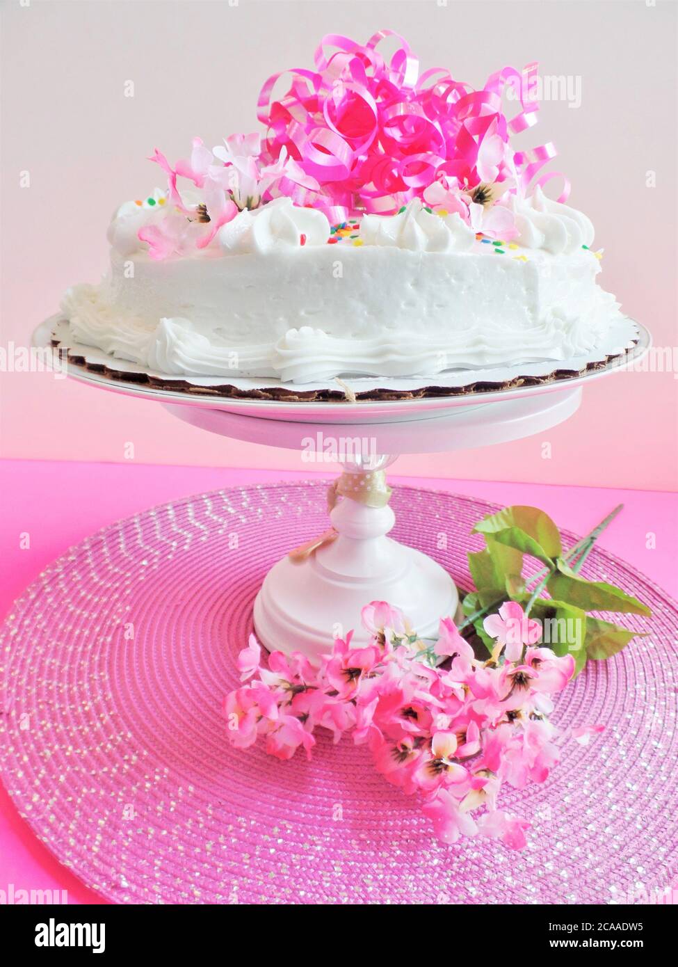 Cake decorated with pink ribbon Stock Photo - Alamy