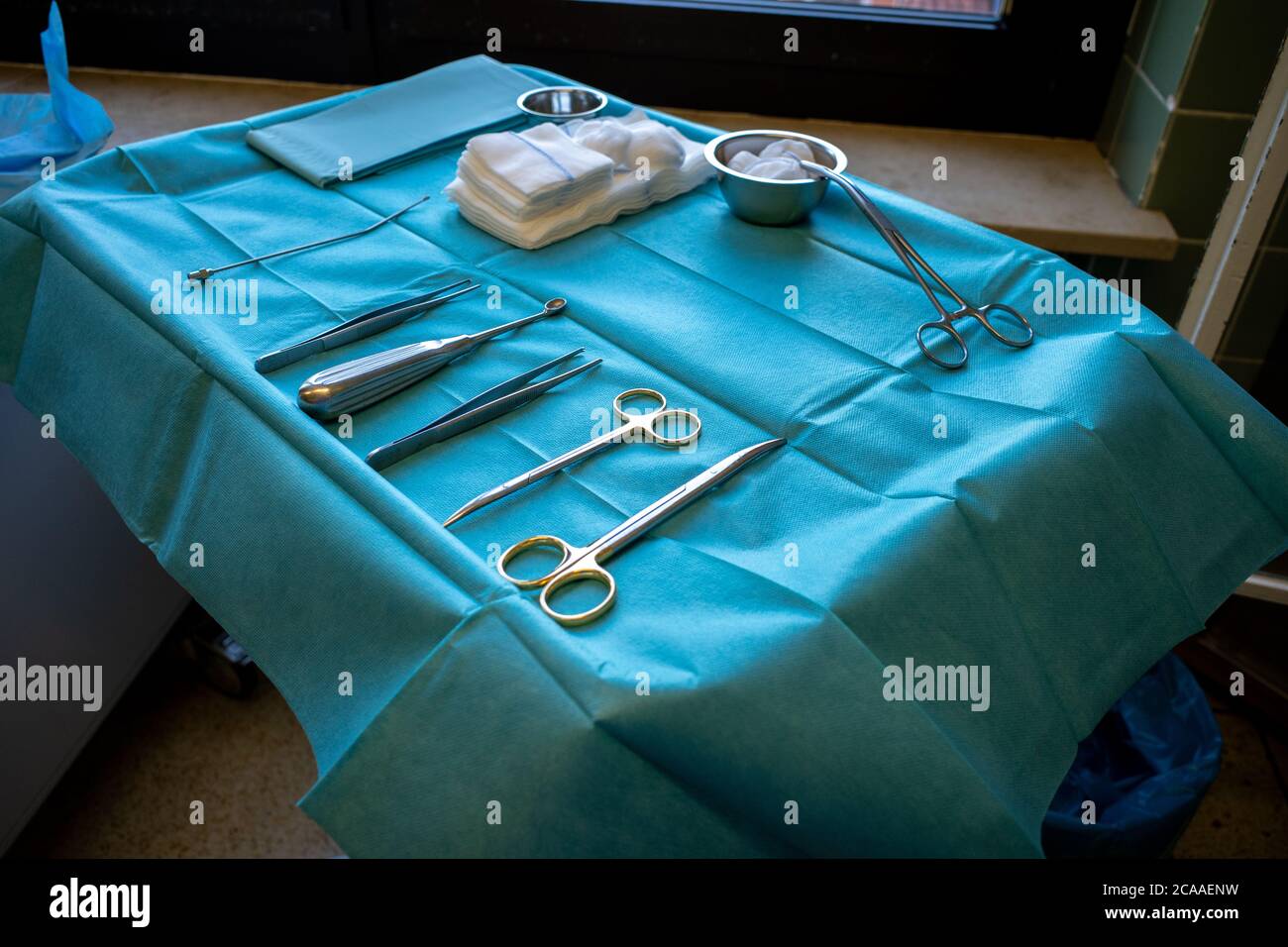 in an operating room there is an instrument table with surgical ...