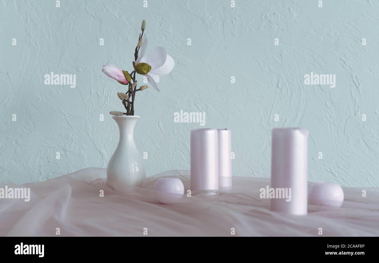 Pink table set up candles and flower vase Stock Photo - Alamy
