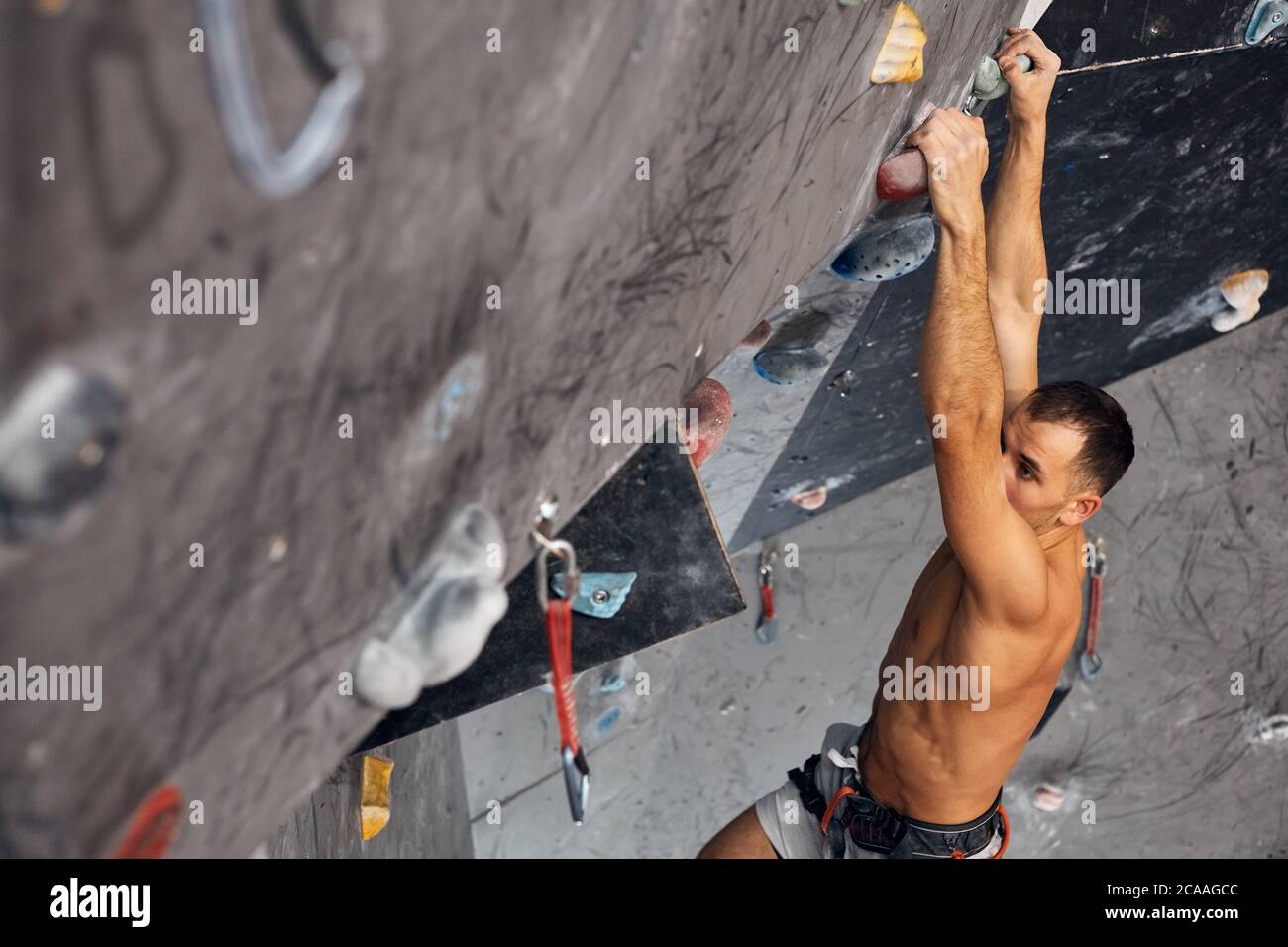 Top view of a professional man climber on a commiting route ...