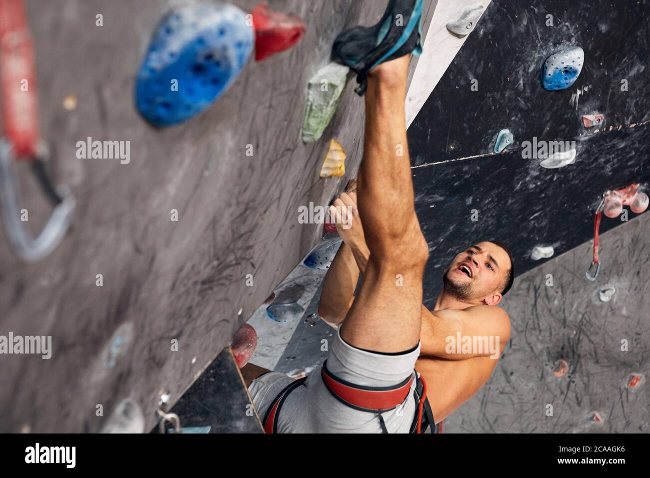Top view of a professional man climber on a commiting route ...